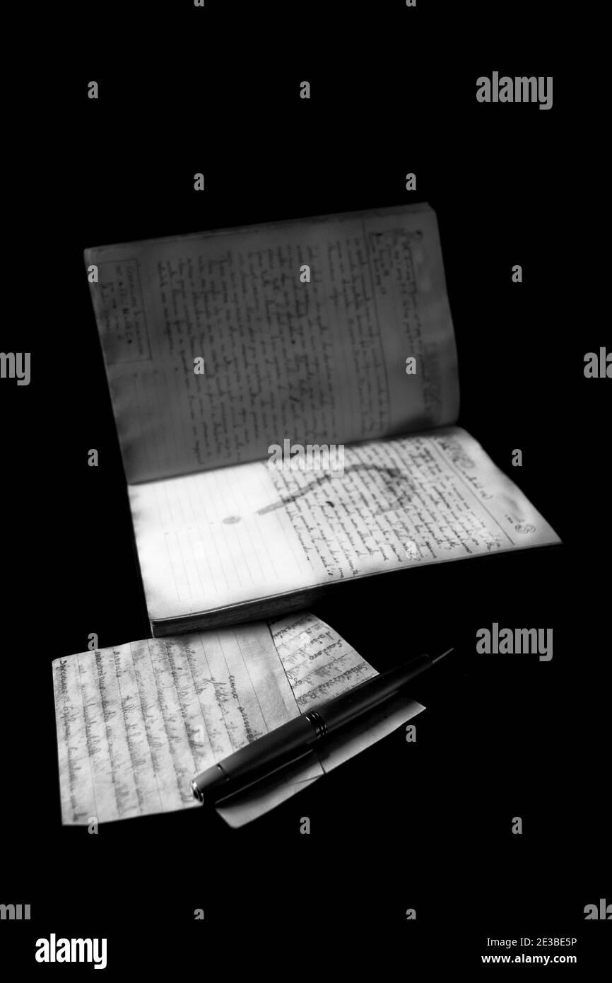old manuscript with handwritten letters on black background Stock Photo ...