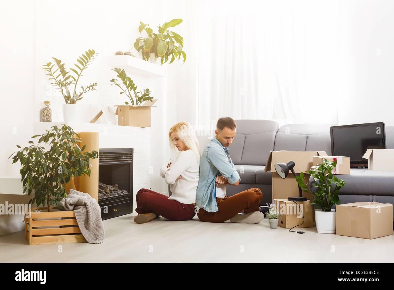 Husband and wife moving in new home Stock Photo - Alamy