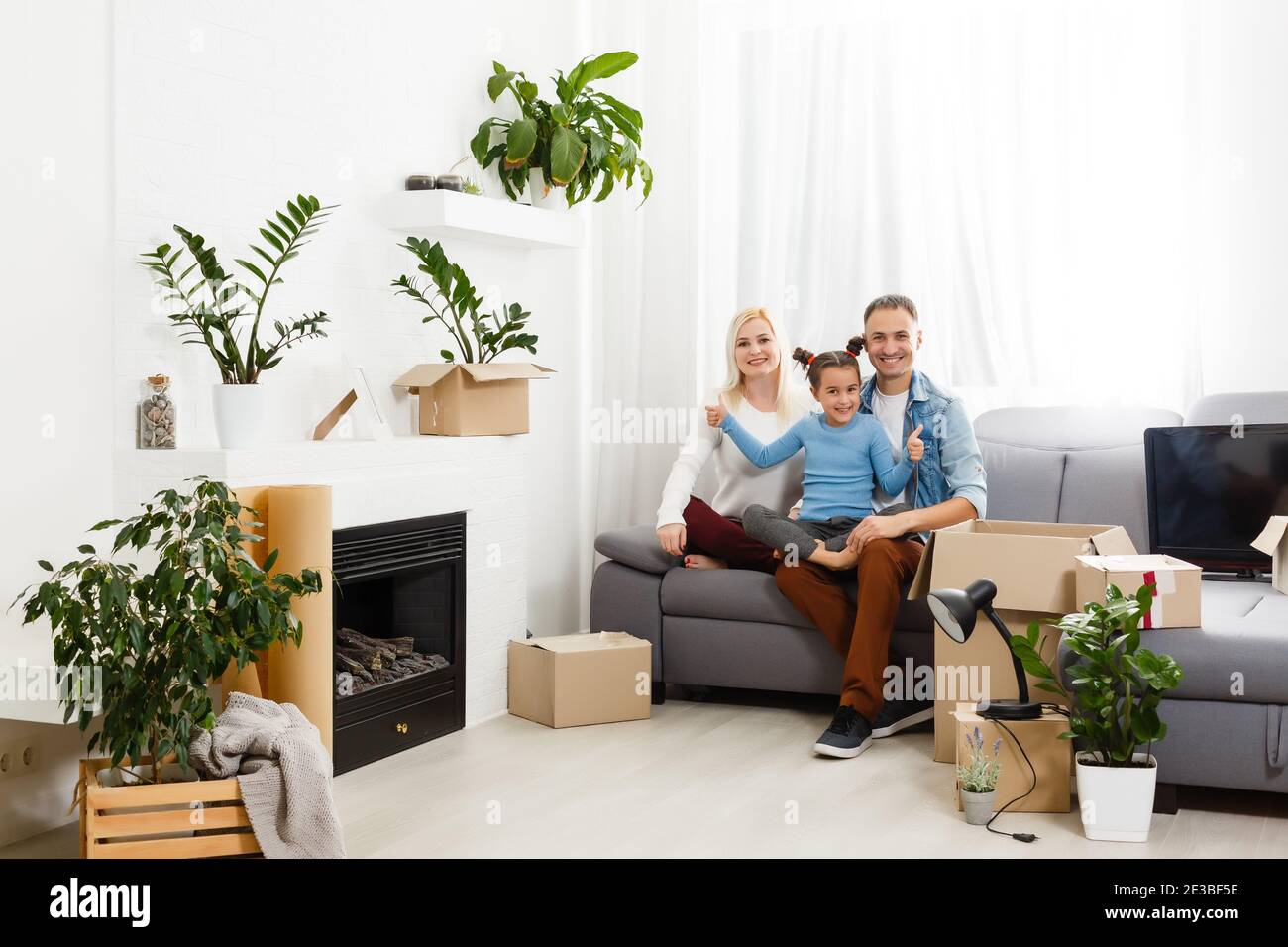 concept housing a young family. Mother father and child in new house ...