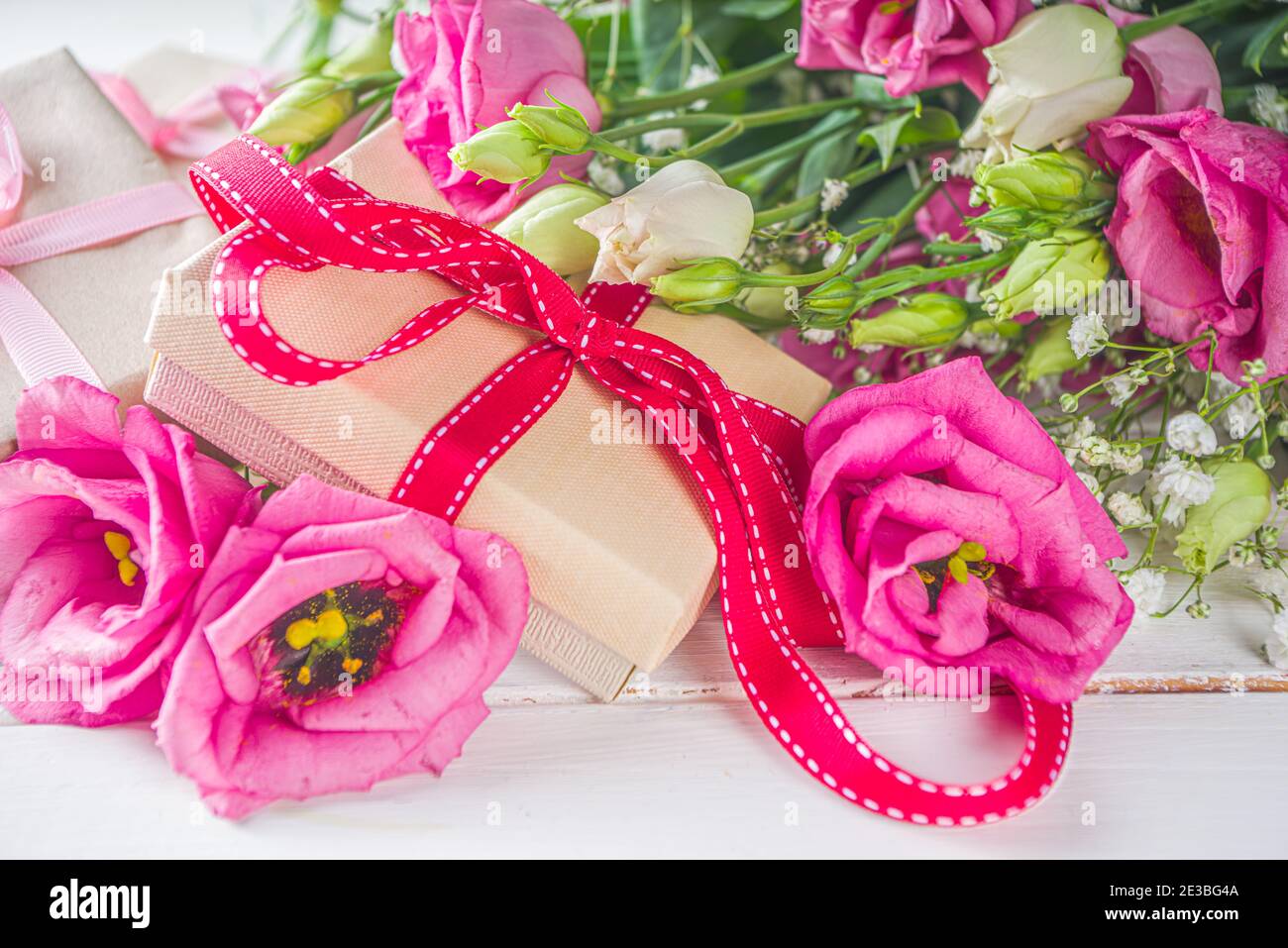Beautiful spring flowers on white wooden background. Festive floral ...