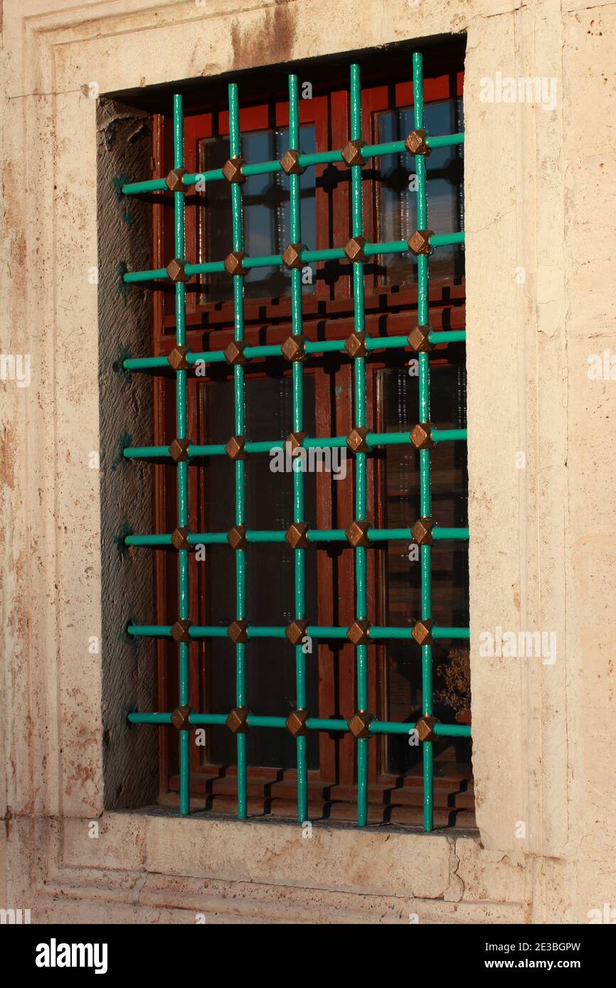 The old stone building. Metal window railing Stock Photo - Alamy