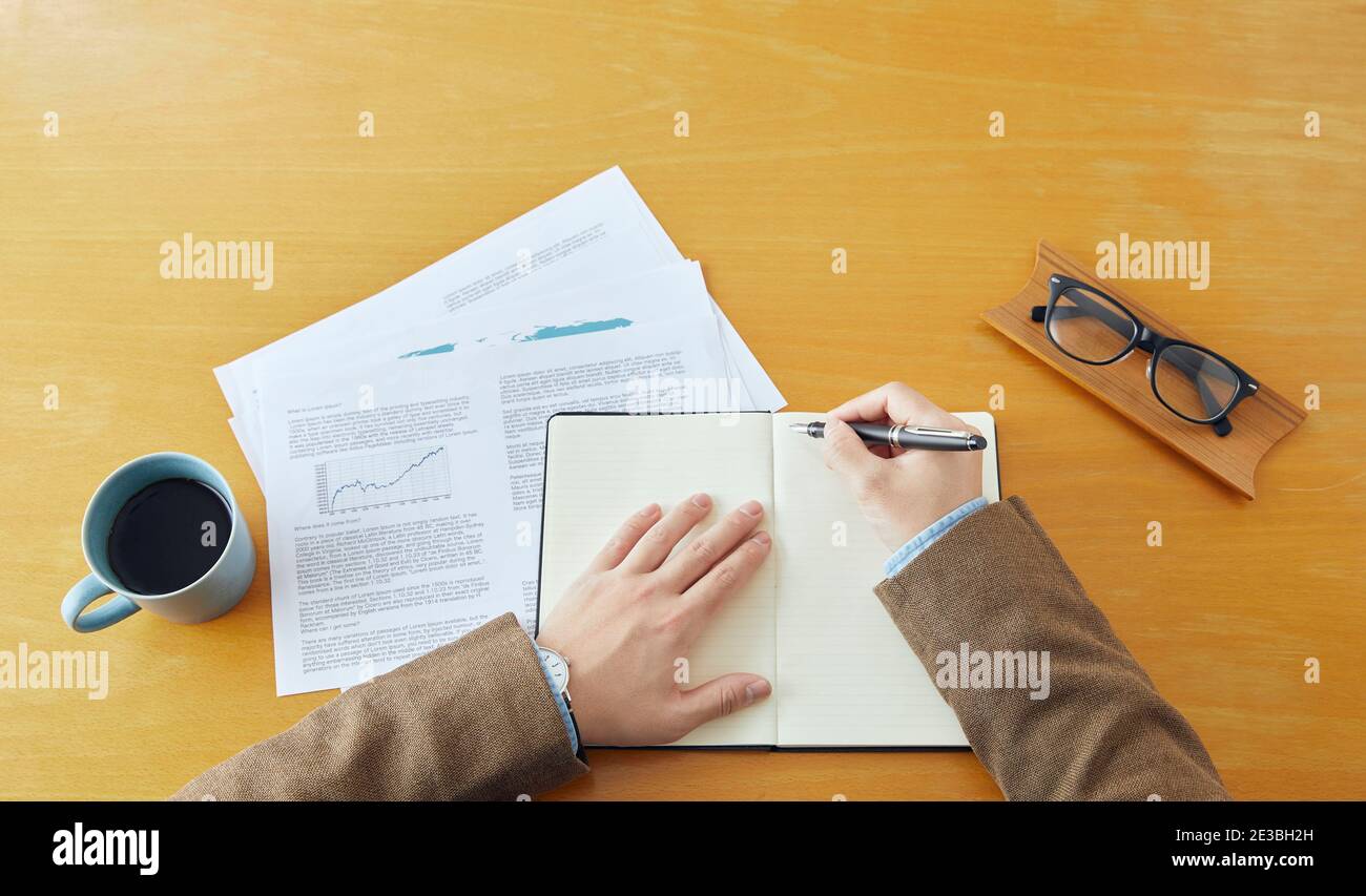 Man writing on paper Stock Photo - Alamy