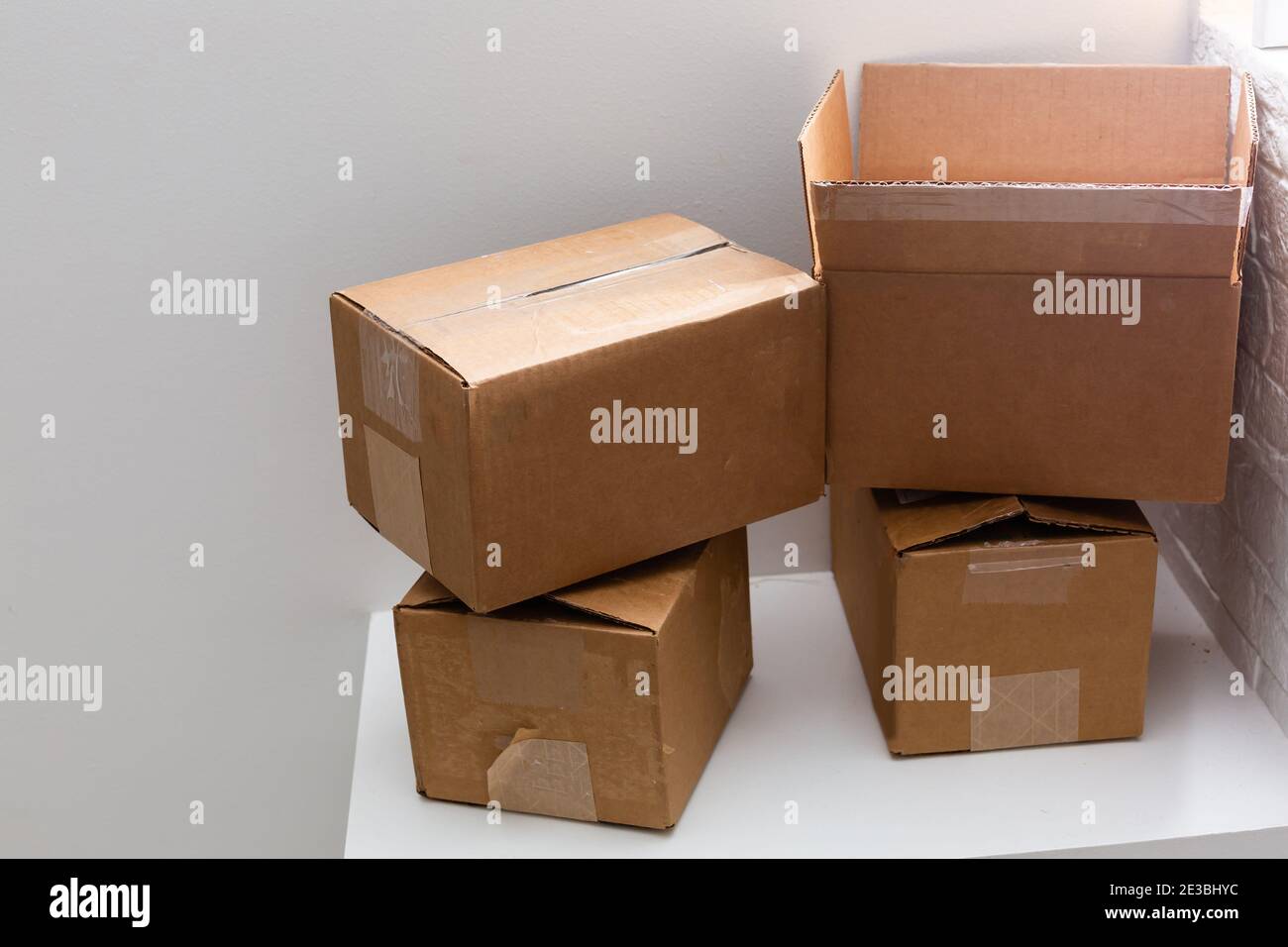 Lot of cardboard boxes on white background Stock Photo - Alamy