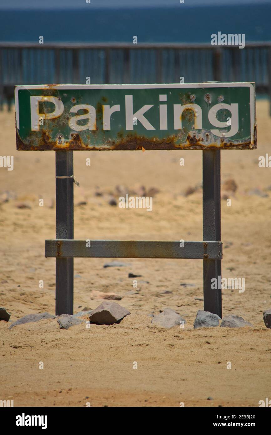 Shot of rusty and weathered parking sign Stock Photo - Alamy