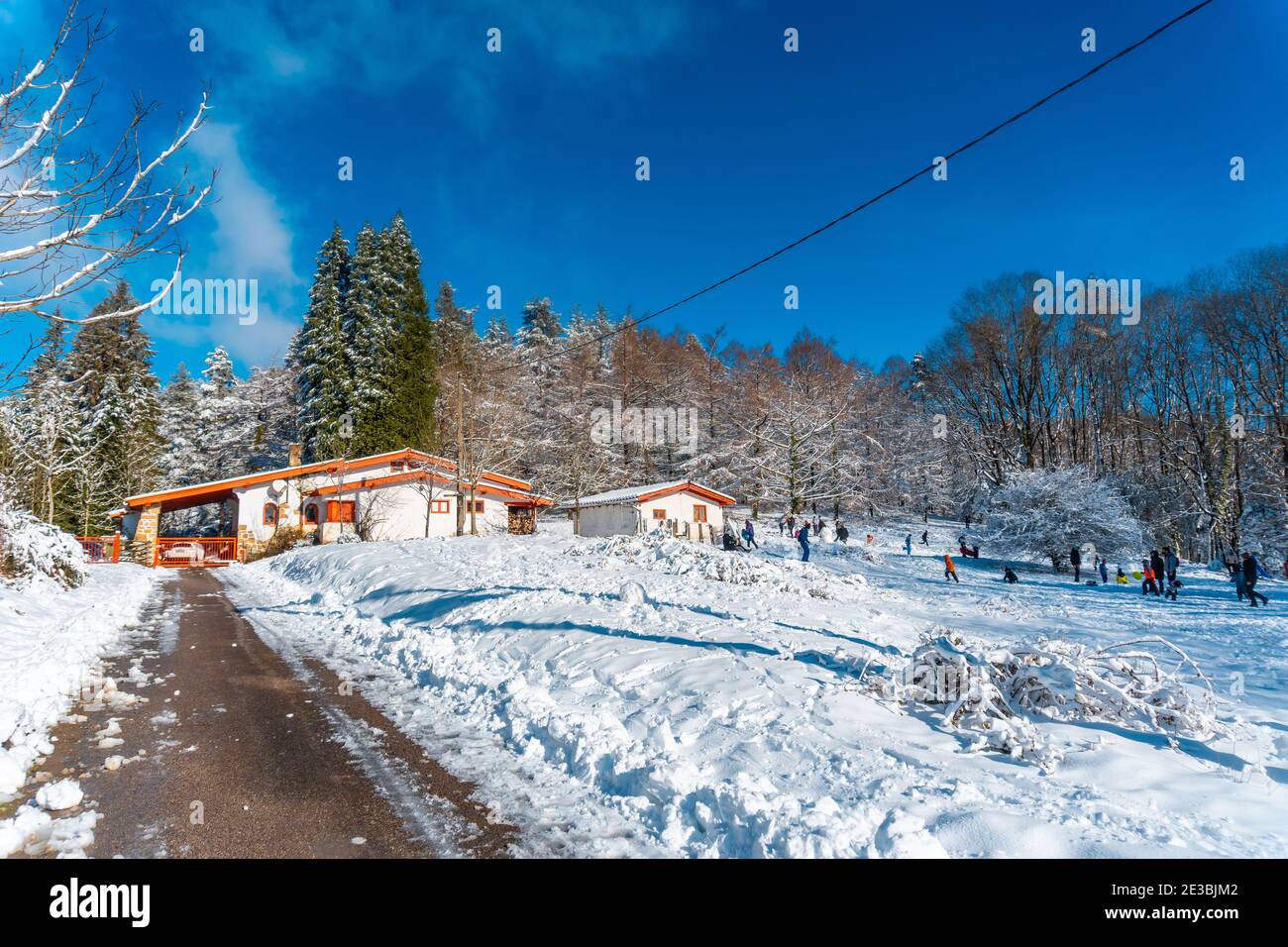Group of tourists in a snowy forest of Artikutza in the Artikutza park ...