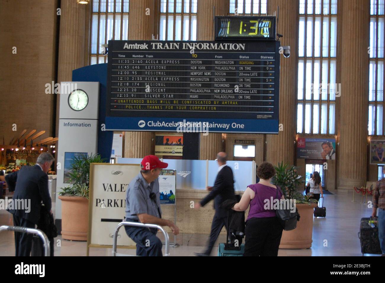 Train station Philadelphia USA notice board Amtrak information people ...