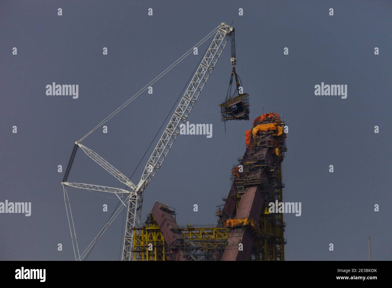 Tower crane at the construction of a giant arch in Qatar Stock Photo ...