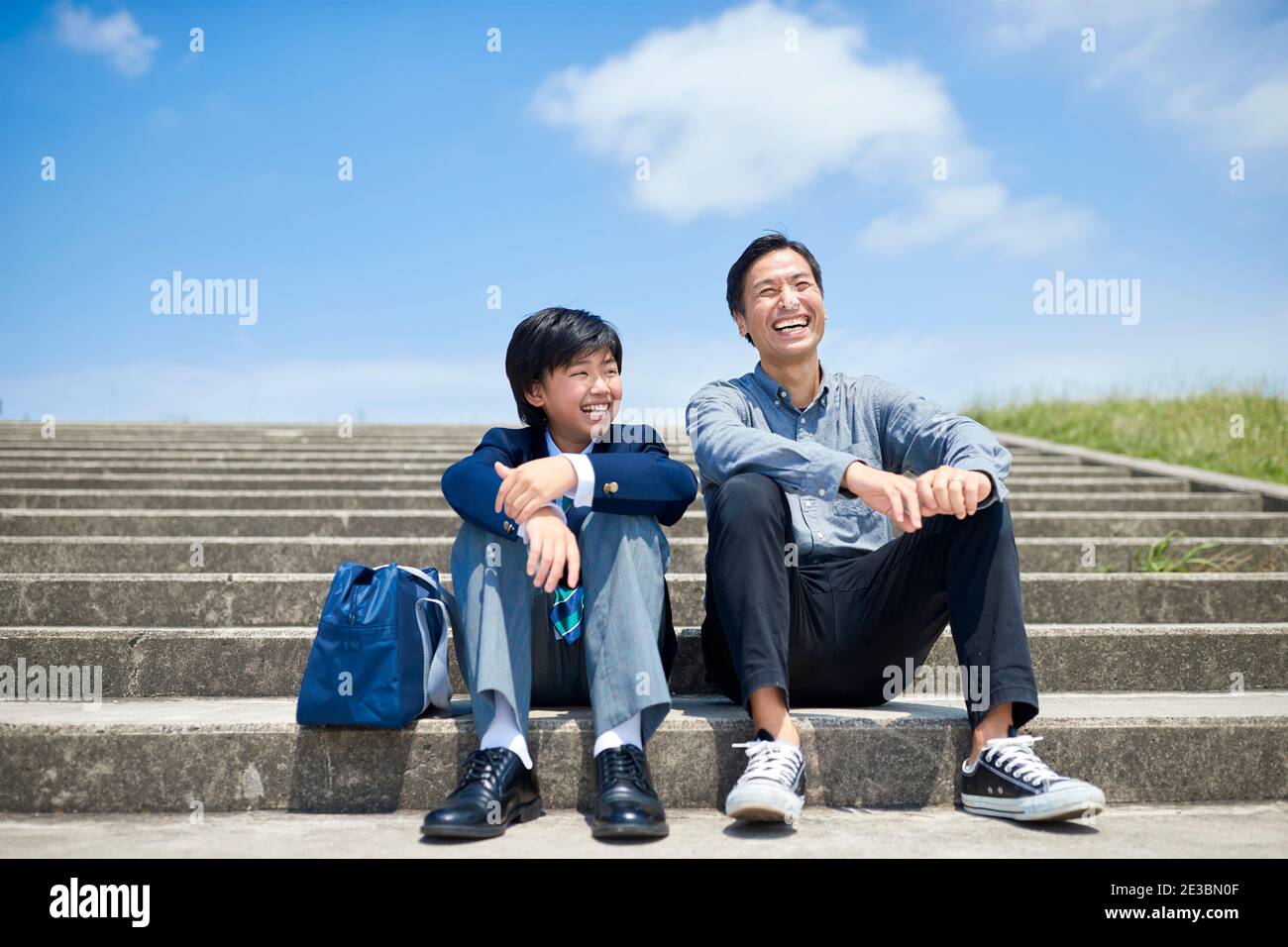 Happy Japanese father and son outdoors Stock Photo - Alamy