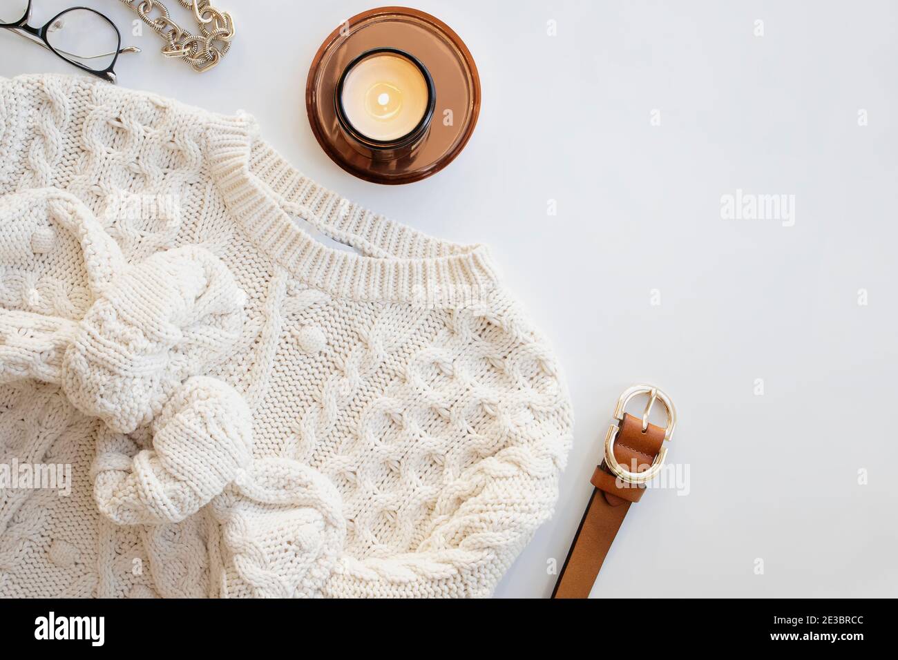 Feminine fashion flat lay with knitted sweater Stock Photo - Alamy