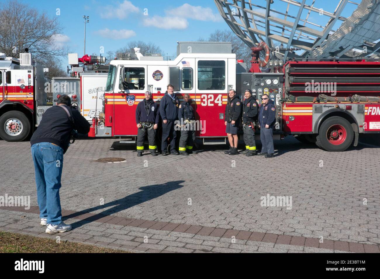 6 firefighters from Engine Company 324 have their photo taken in front ...