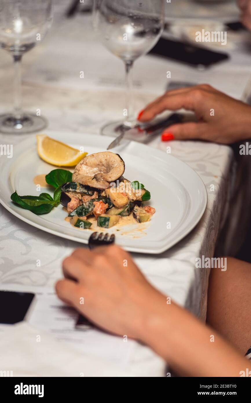 portion of delicious fish fillet in sauce at the restaurant. small ...