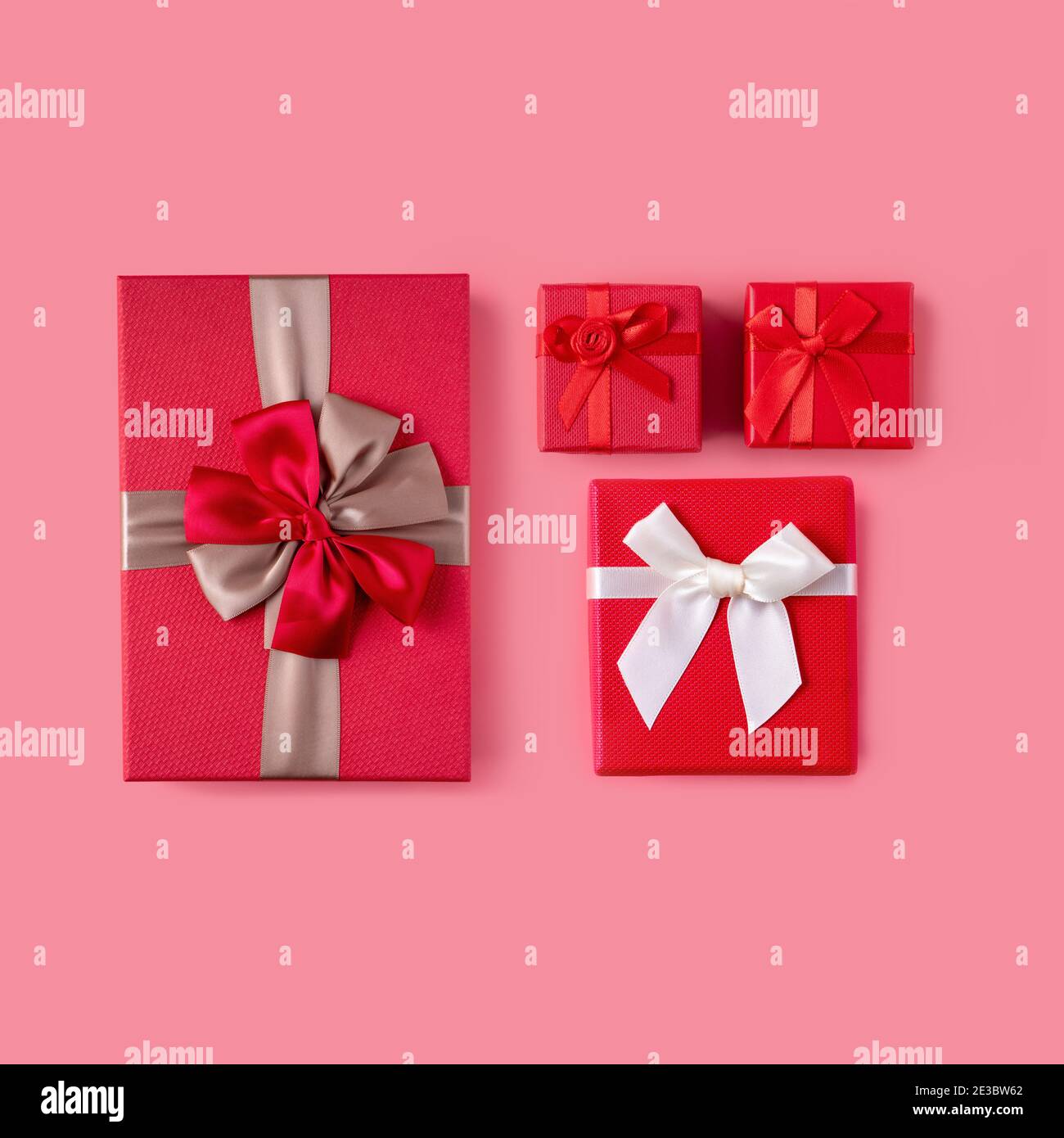 Beautiful gift box wrapped with ribbon bow on pastel pink background ...