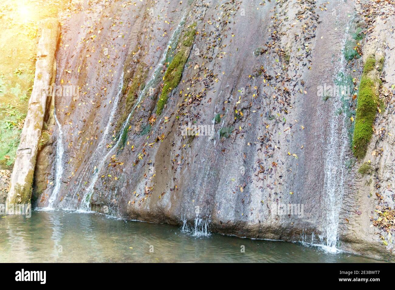 Water flowing or falling down in the waterfall. nature background space ...
