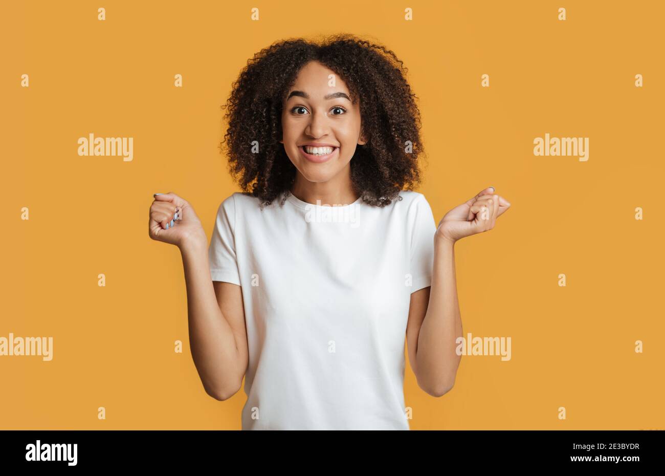 Positive, win and freedom. Young emotional beautiful african american ...