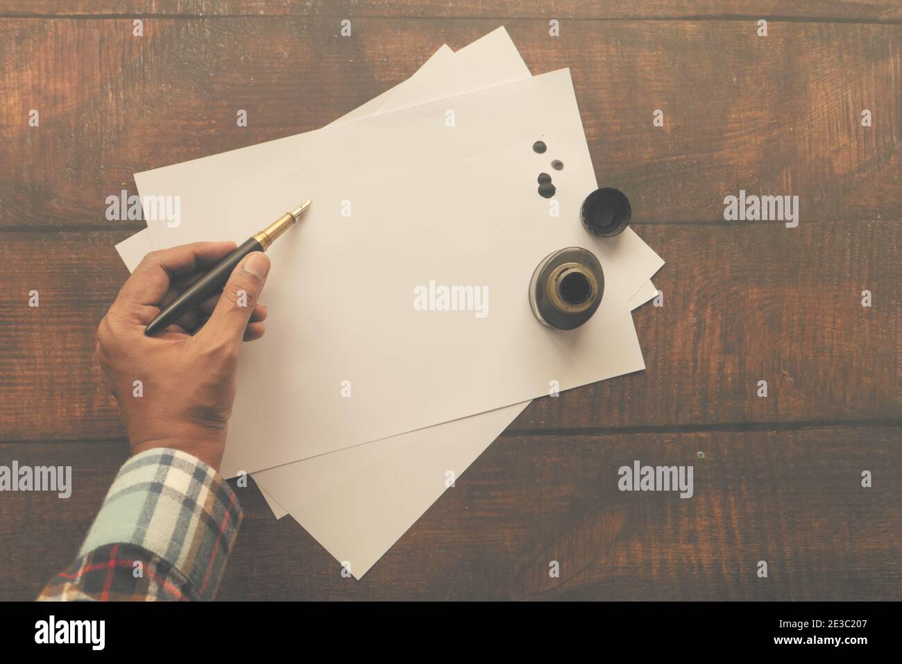 top view of man hand writing a letter with fountain pen Stock Photo - Alamy