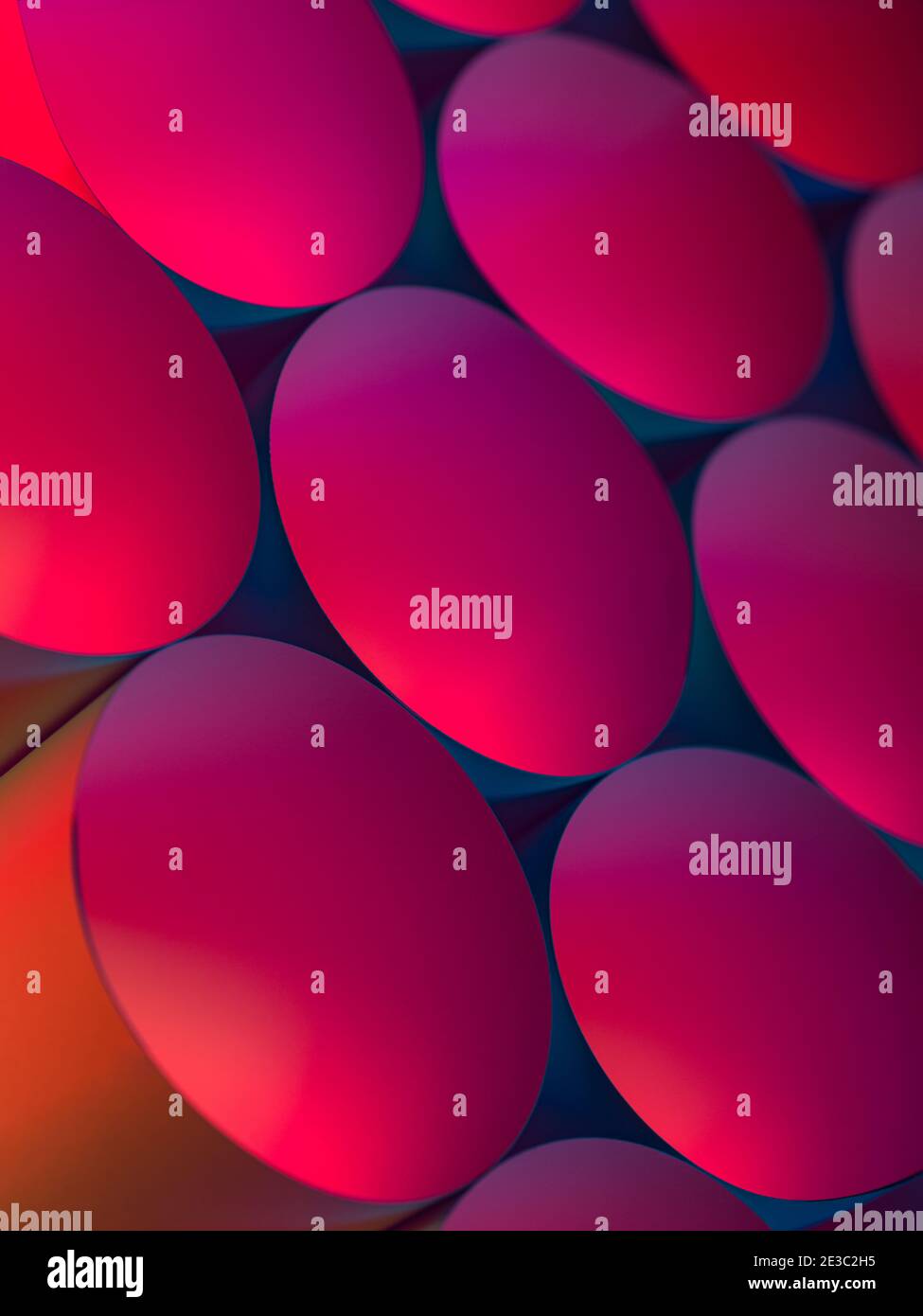 Studio shot macro detail paper circles illuminated with red and blue ...