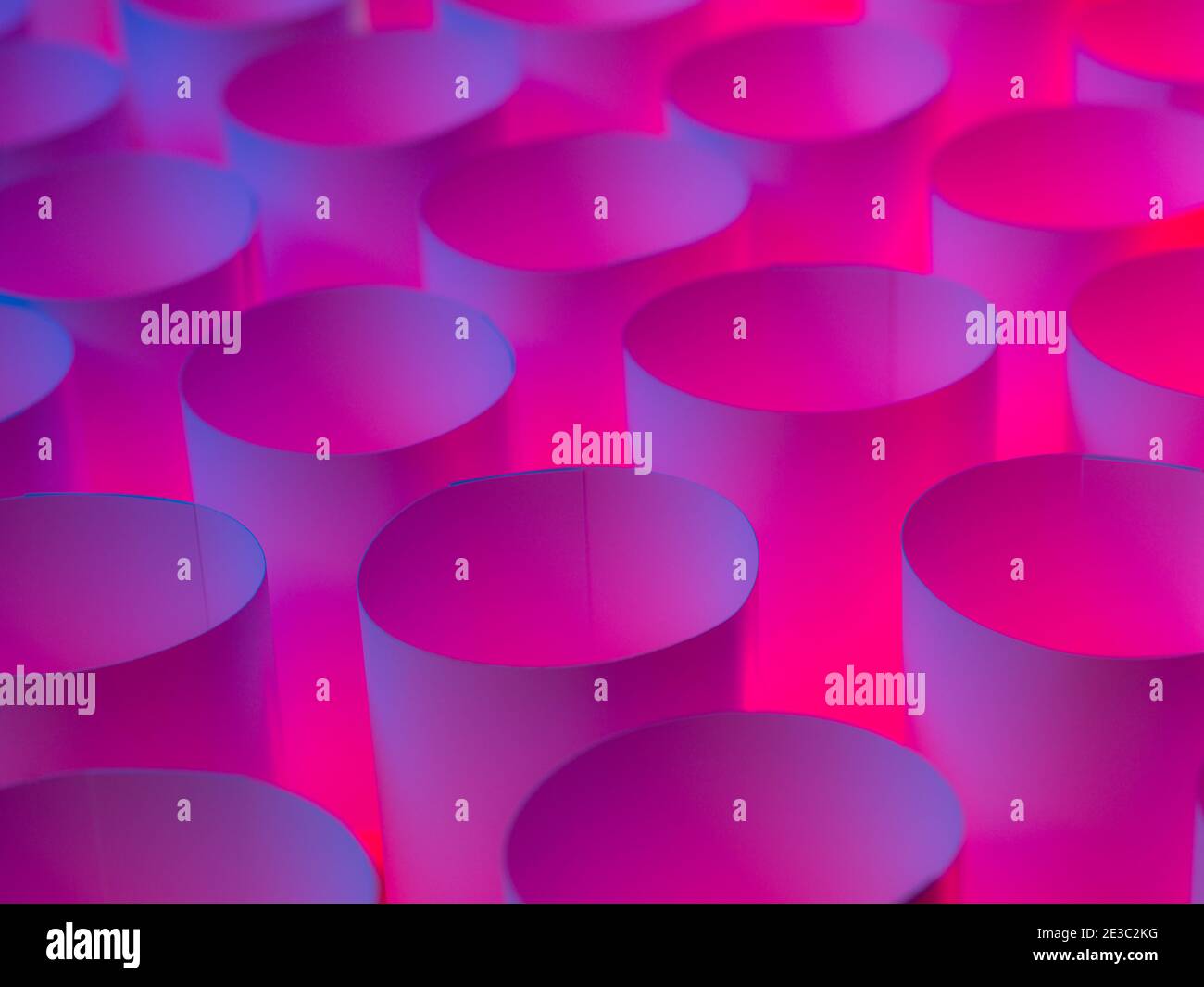 Studio shot macro detail paper circles illuminated with red and blue ...