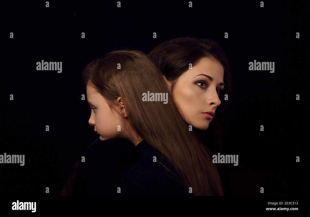Sad serious thinking daughter hugging her unhappy mother with pensive ...