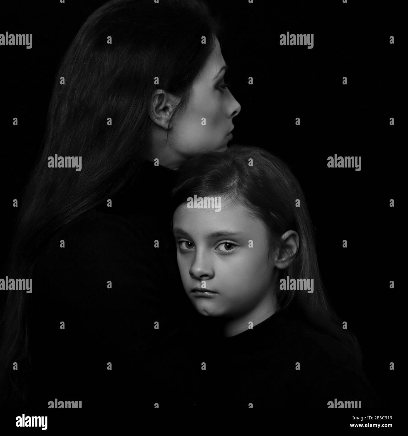 Two woman hugging unhappy Black and White Stock Photos & Images - Alamy