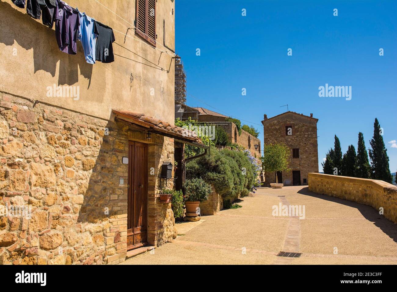 Historic stone buildings on the old walls of Pienza in Siena Province ...