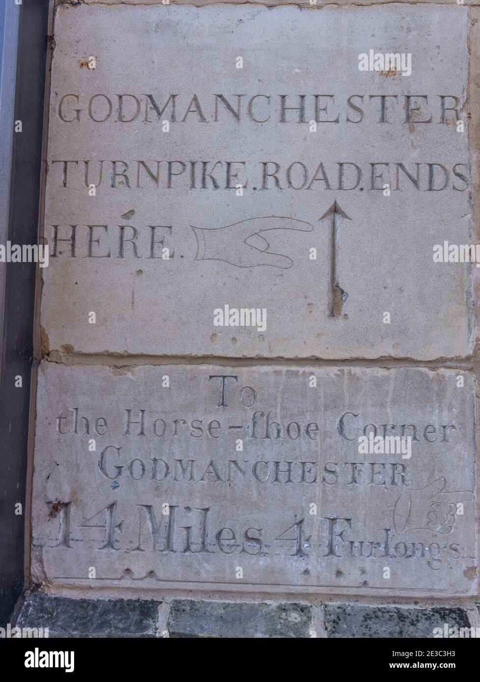 Old stone stone sign and measurements for Godmanchester turnpike road ...