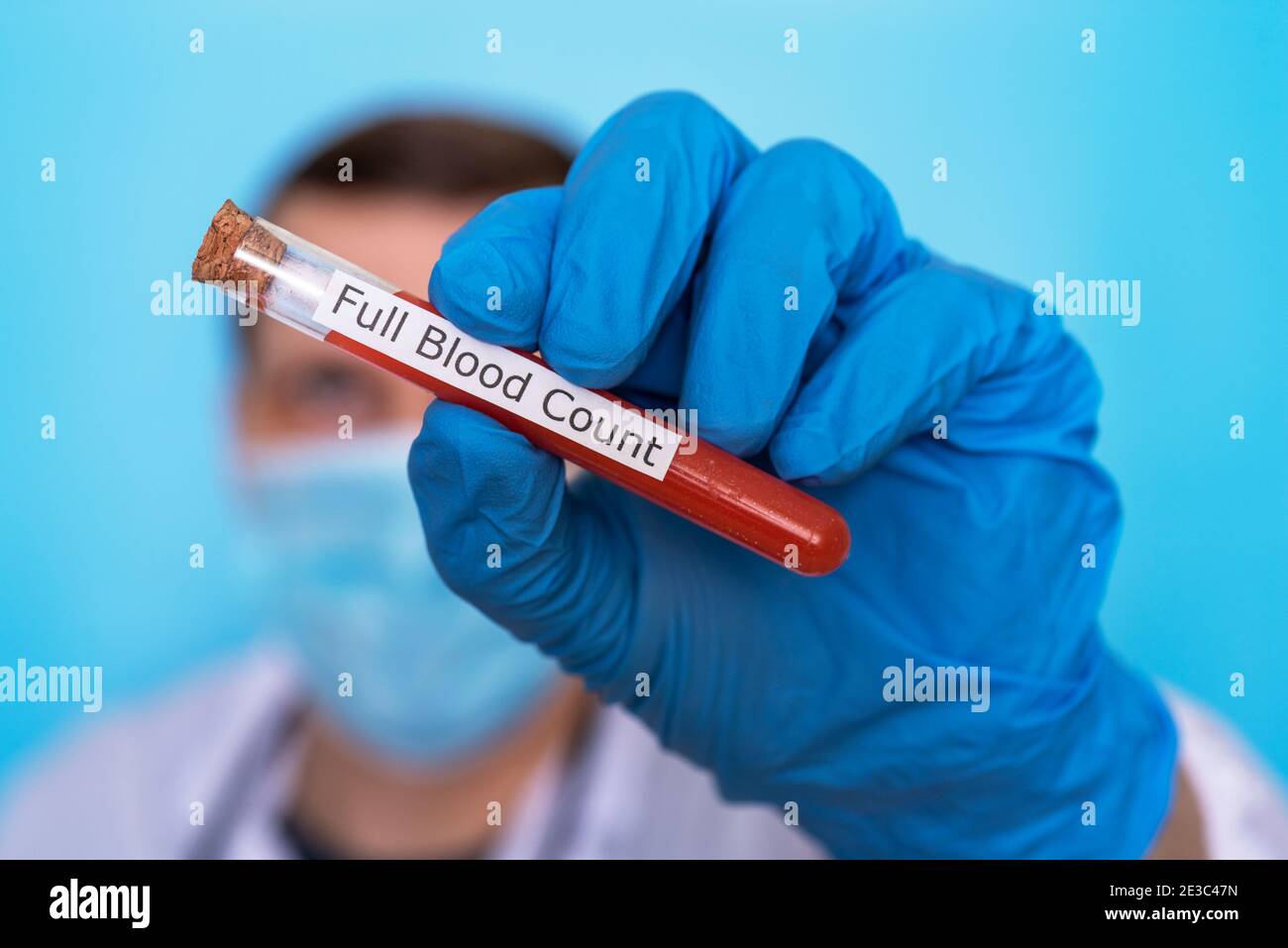 The hand holds the test for a complete blood test. Concept of blood ...