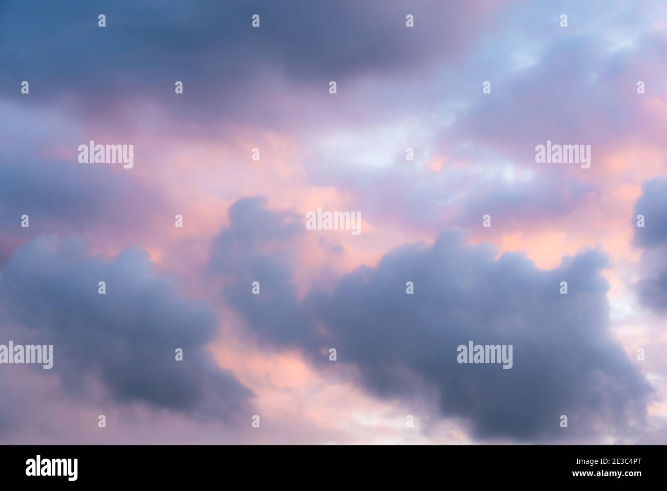 Soft pink clouds in sunset sky Stock Photo - Alamy
