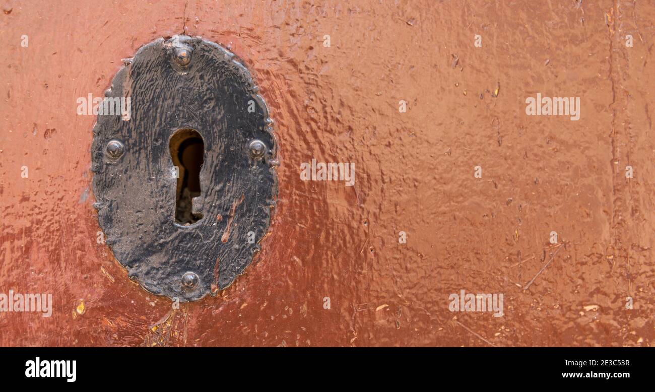 close up on the old lock with an interesting texture on the door, home ...
