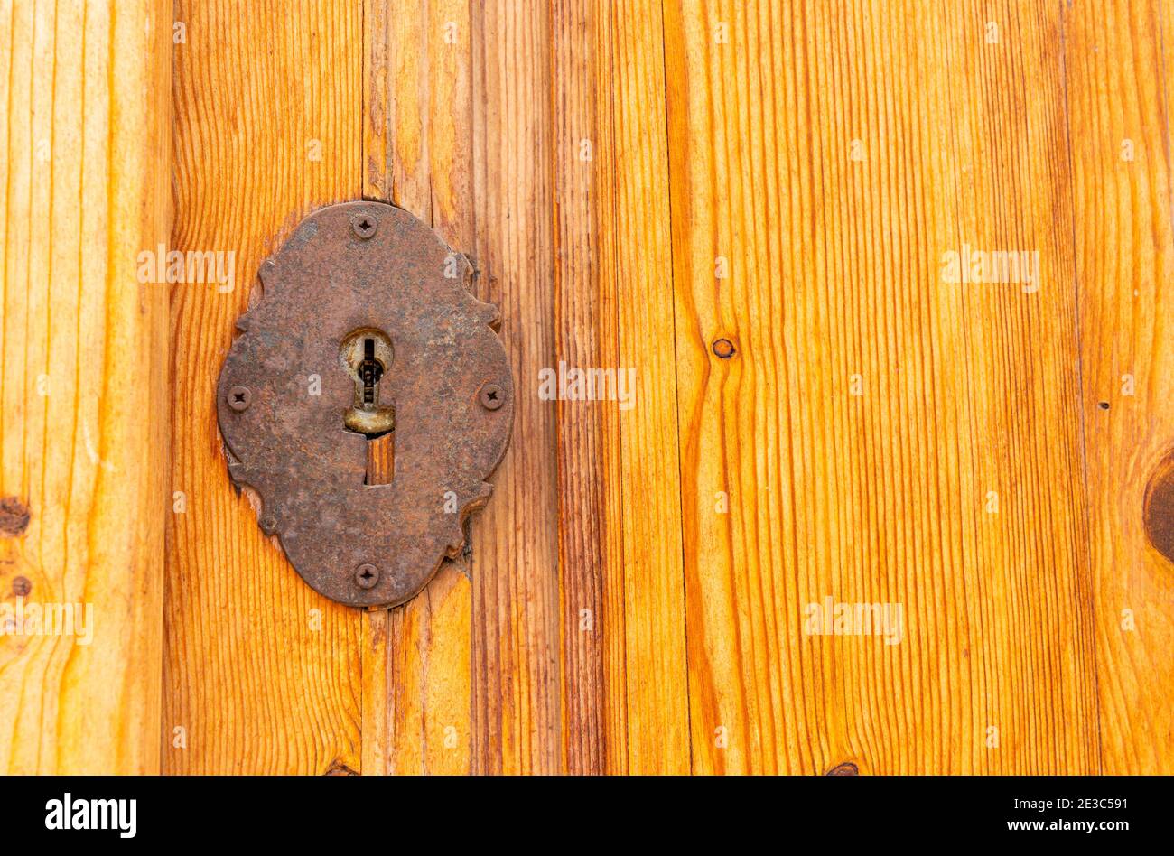 close up on the old lock with an interesting texture on the door, home ...