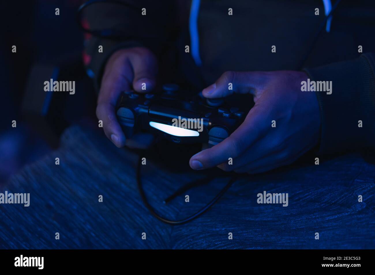 Closeup of a male gamer playing with a controller and streaming i Stock ...