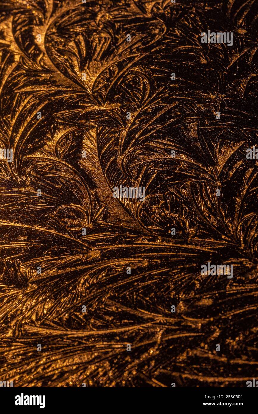 Ice patterns or frost patterns formed on the bodywork of a car during a ...