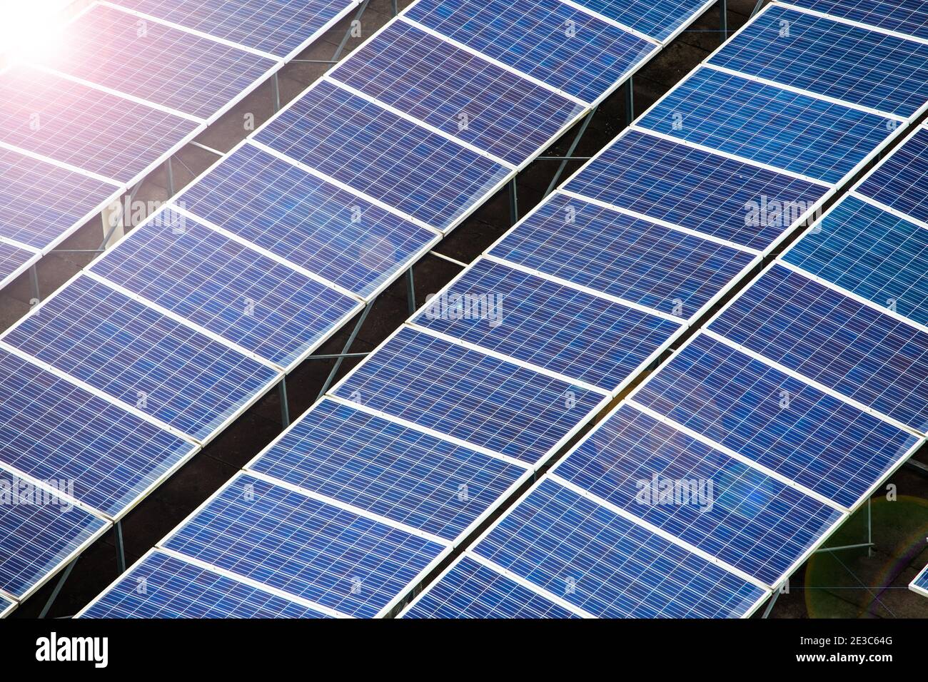 Artistic image of a top down view of rows of solar panels on the roof ...