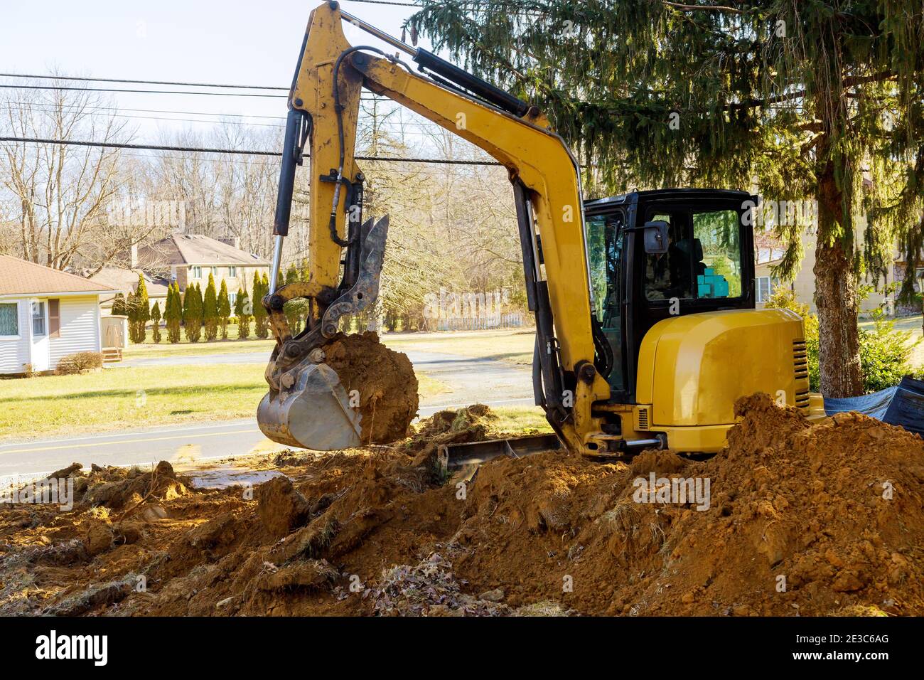 Excavator loader at earth moving works around the construction site ...
