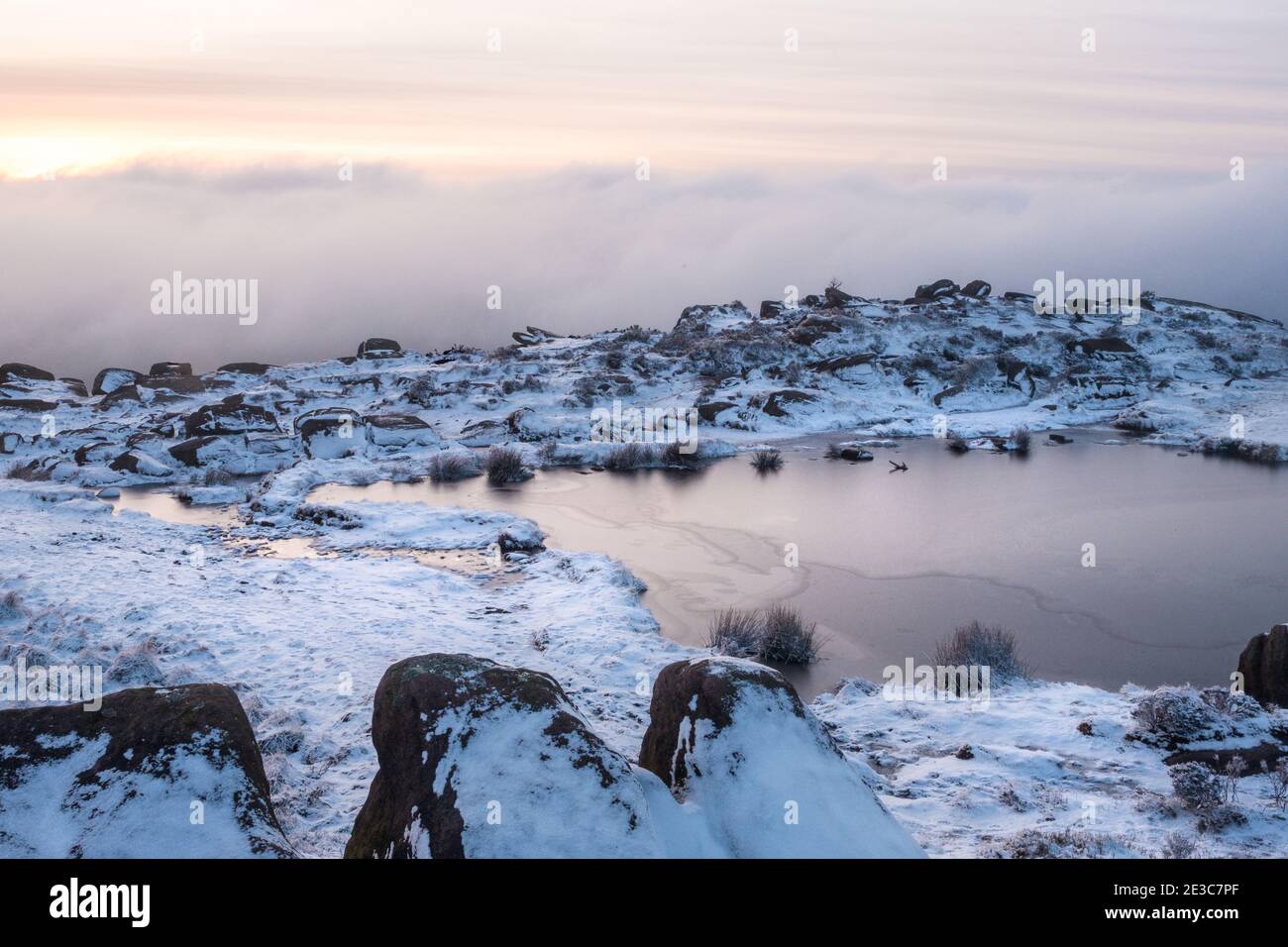 The frozen Doxeys Pool on the Roaches ridge in the Staffordshire ...