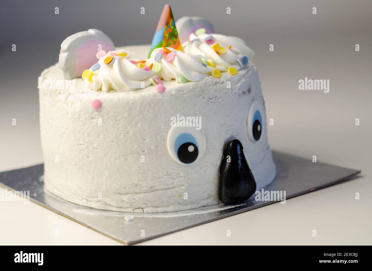 Madeira sponge layered with frosting and raspberry jam, covered in soft ...