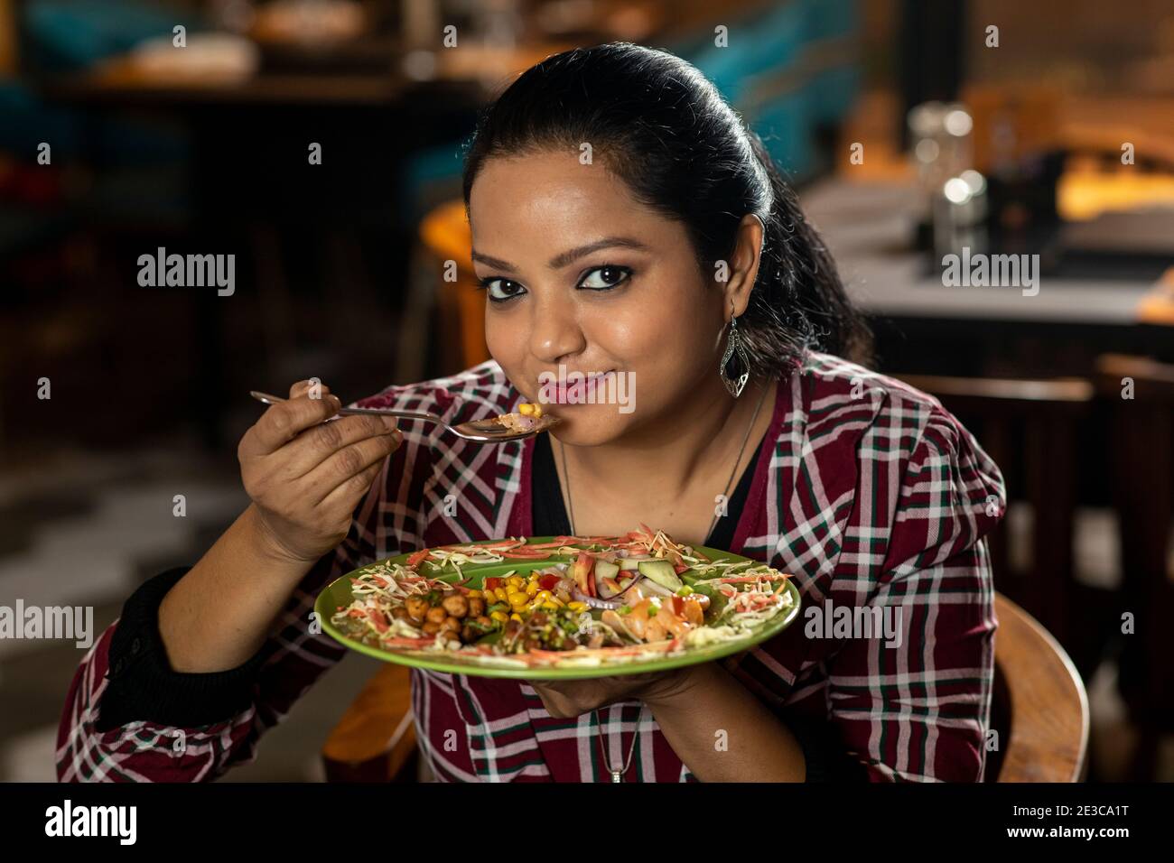 Attractive woman eating alone restaurant hi-res stock photography and ...