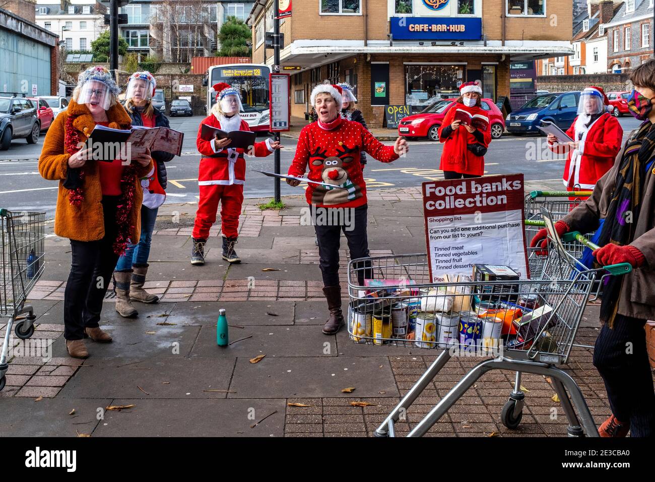 Local Women Sing Christmas Carols At A Food Bank Collection Point ...