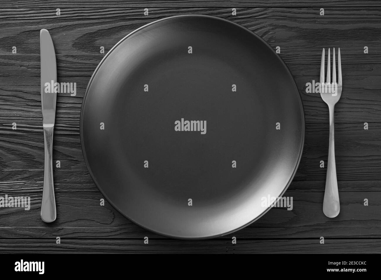 Minimalistic black background table setting in a restaurant. minimalism ...