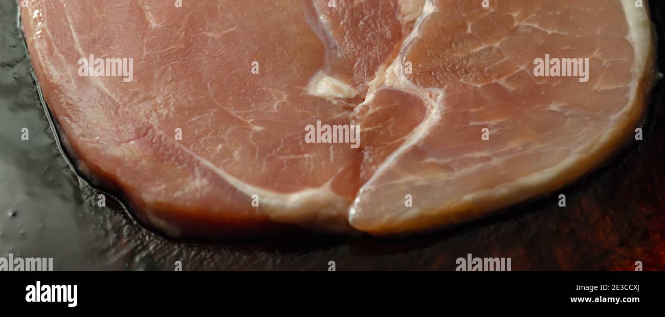 Smoked gammon steak formed from selected cuts of cured pork leg ...