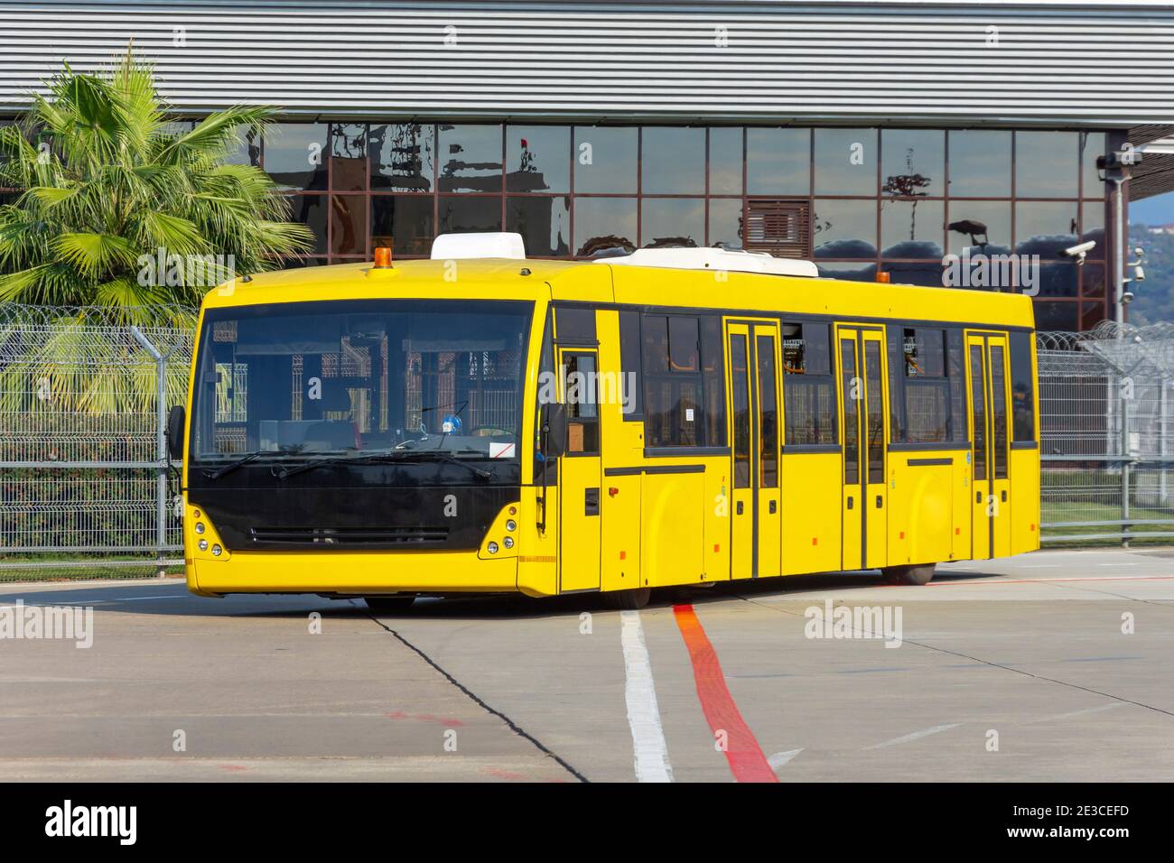 Shuttle yellow buse to transport passengers from the terminal building ...