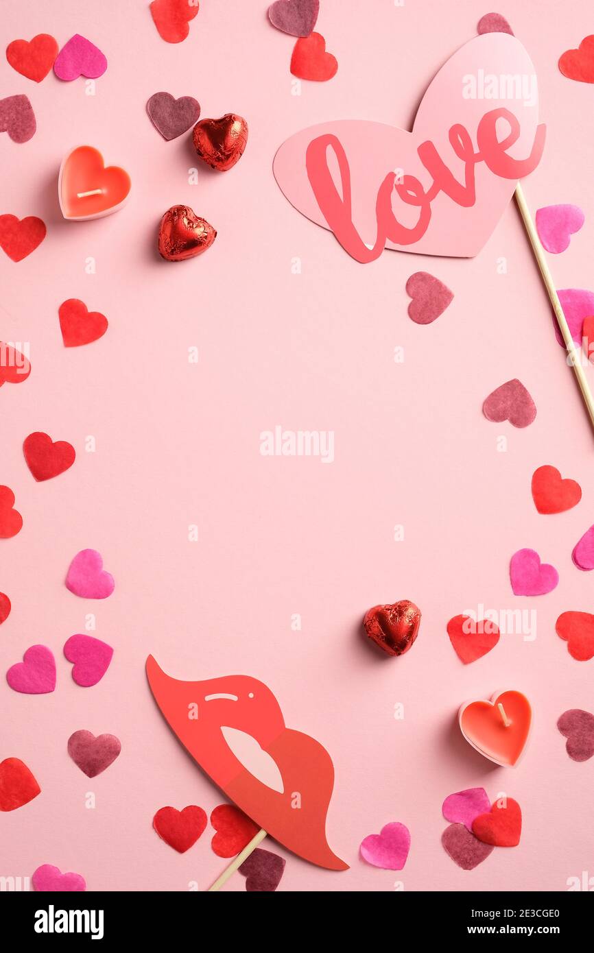 Valentines Day flat lay composition with hearts and decorations on pink ...