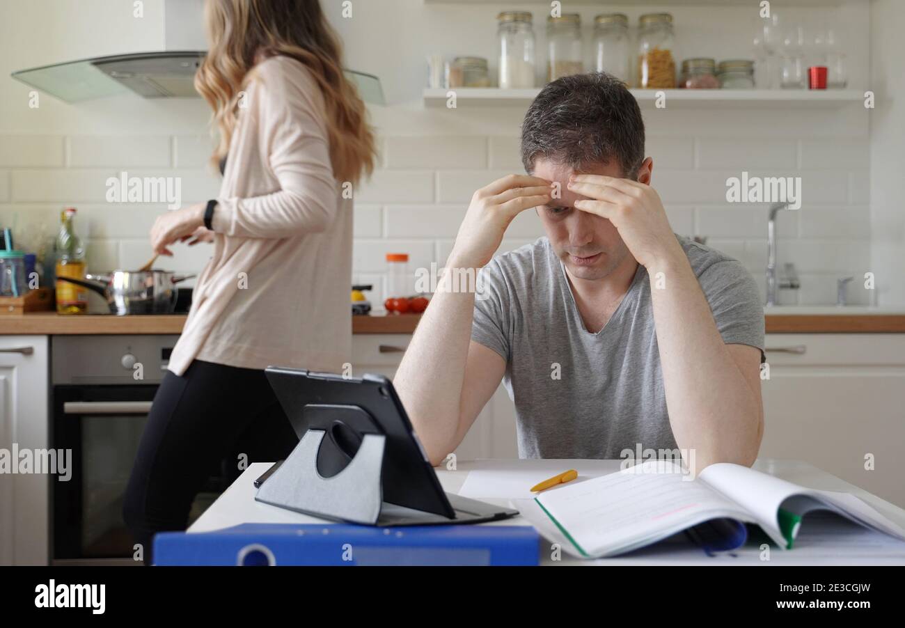 Man tired of self-isolation works at home. Coronavirus lockdown Stock ...