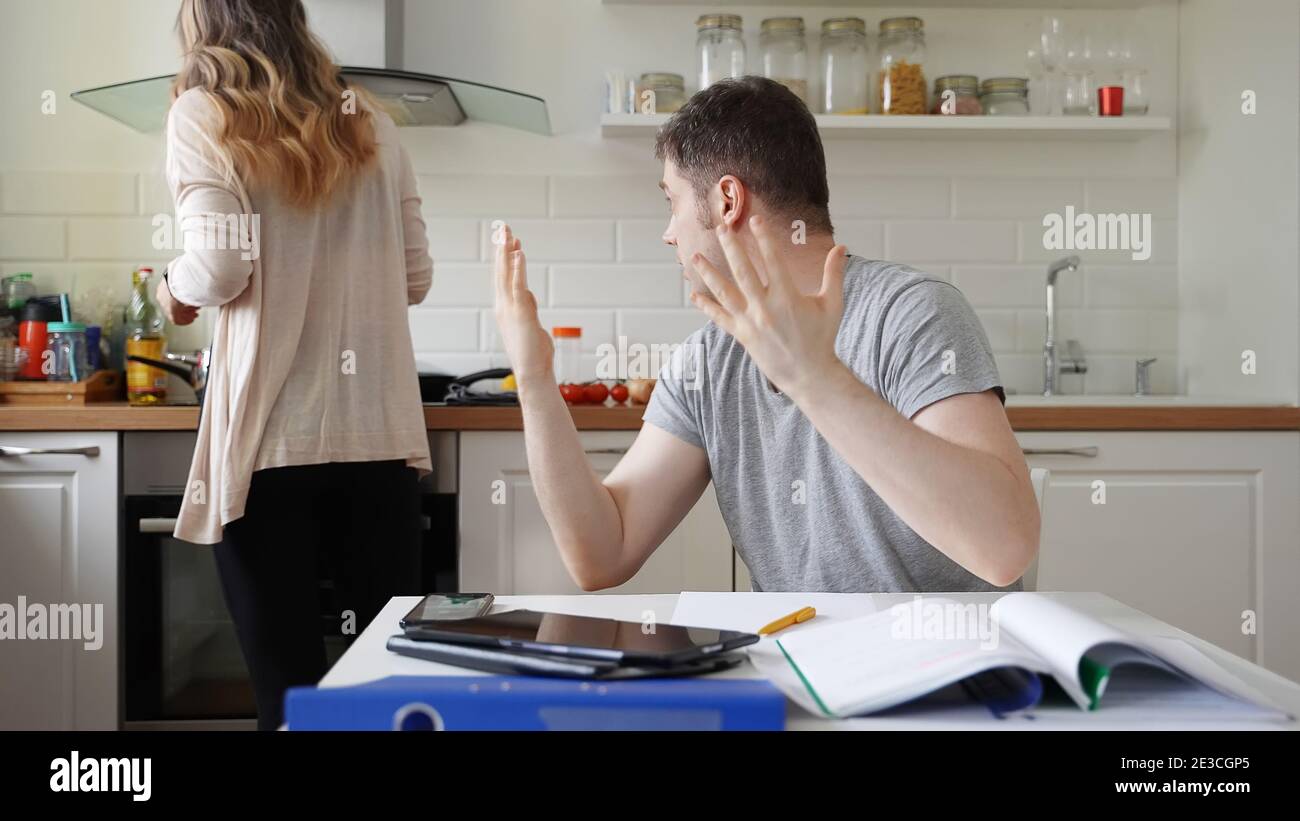 Husband yelling at his wife. Tired of working at home Stock Photo - Alamy