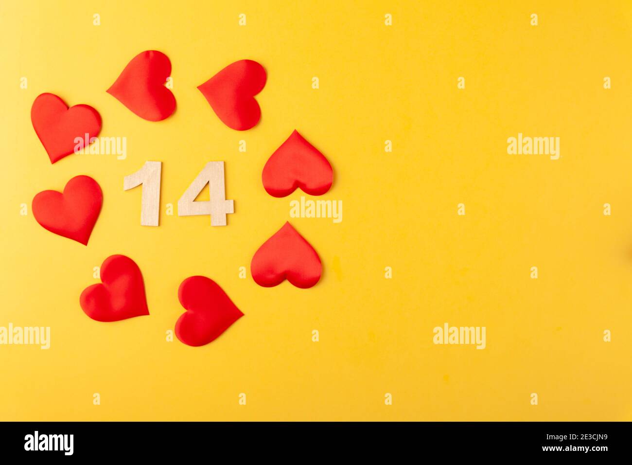 Red hearts in circle, golden numbers 14 on yellow background, greeting ...