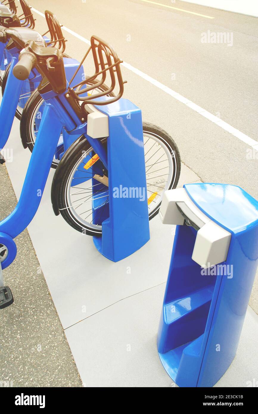 Blue Bicycles at the Bike Stands in the City Stock Photo - Alamy