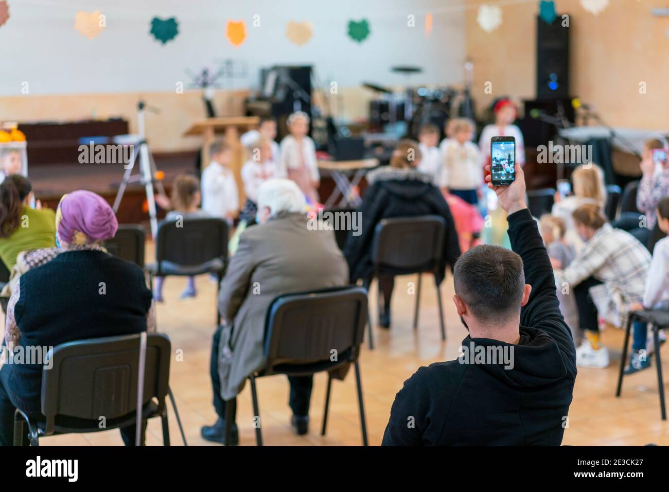 Parents at the performance of children in kindergarten or school ...