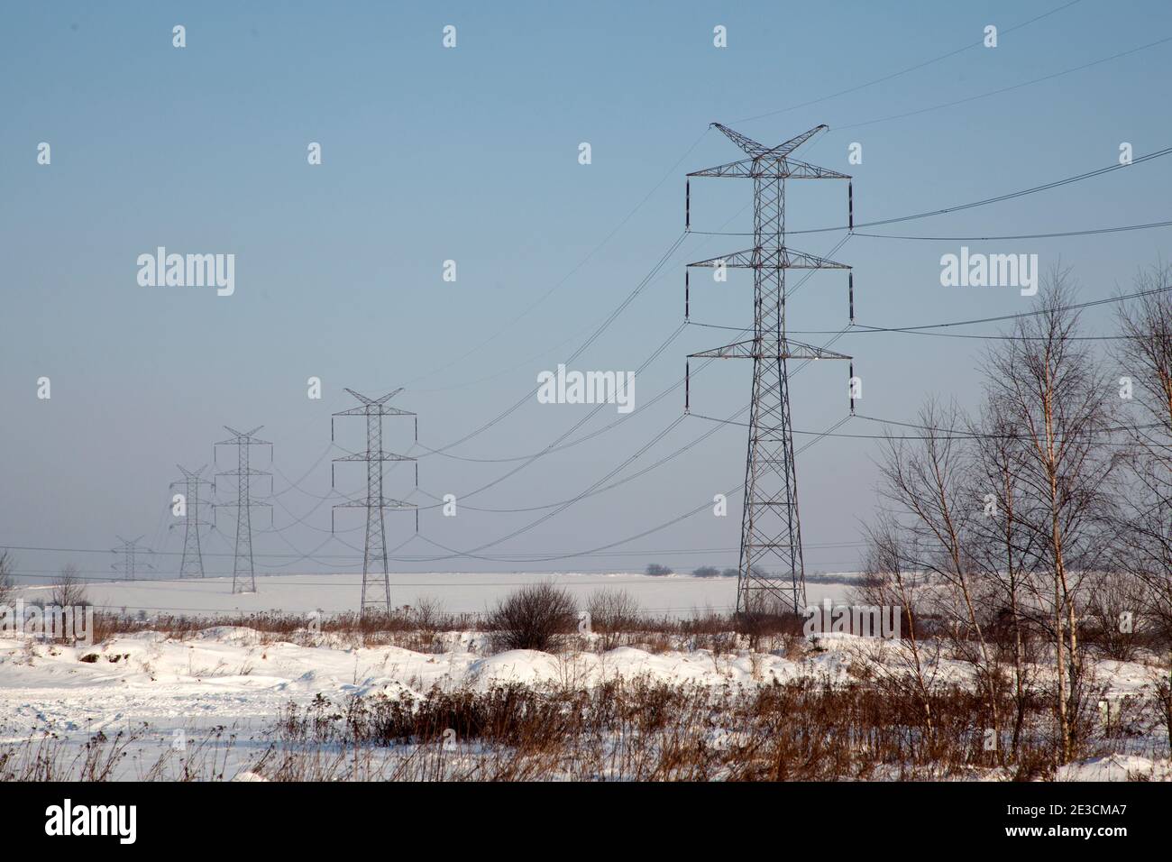 Electric Pylons in a snowy landscape Stock Photo - Alamy