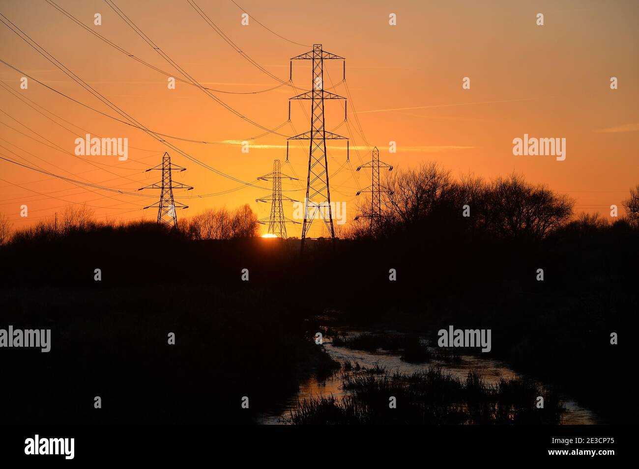 Pylons at sunset in Aylestone Meadows in Leicester Stock Photo - Alamy