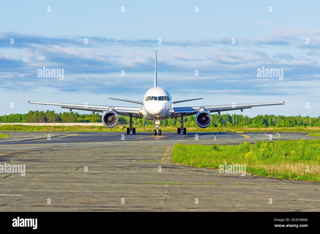 Aircraft on the runway is a front view of the engine and chassis sky ...