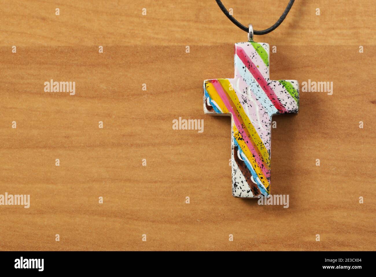 Colorful Christian cross on a wooden background with copy space Stock ...